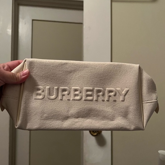 Burberry | Bags | Burberry Cream Canvas Embossed Logo Makeup Pouch ...